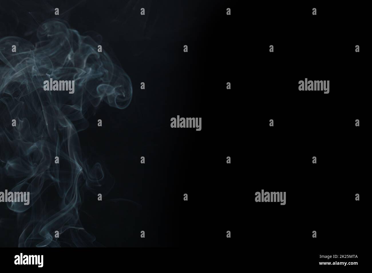 Abstract Smoke swirls on black background Stock Photo - Alamy