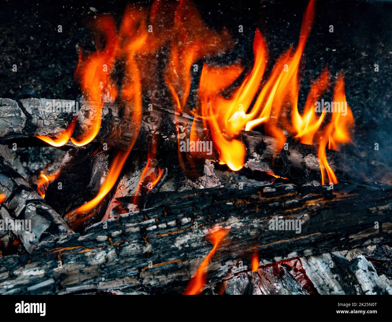 Orange flames of fire of a wood fire Stock Photo - Alamy