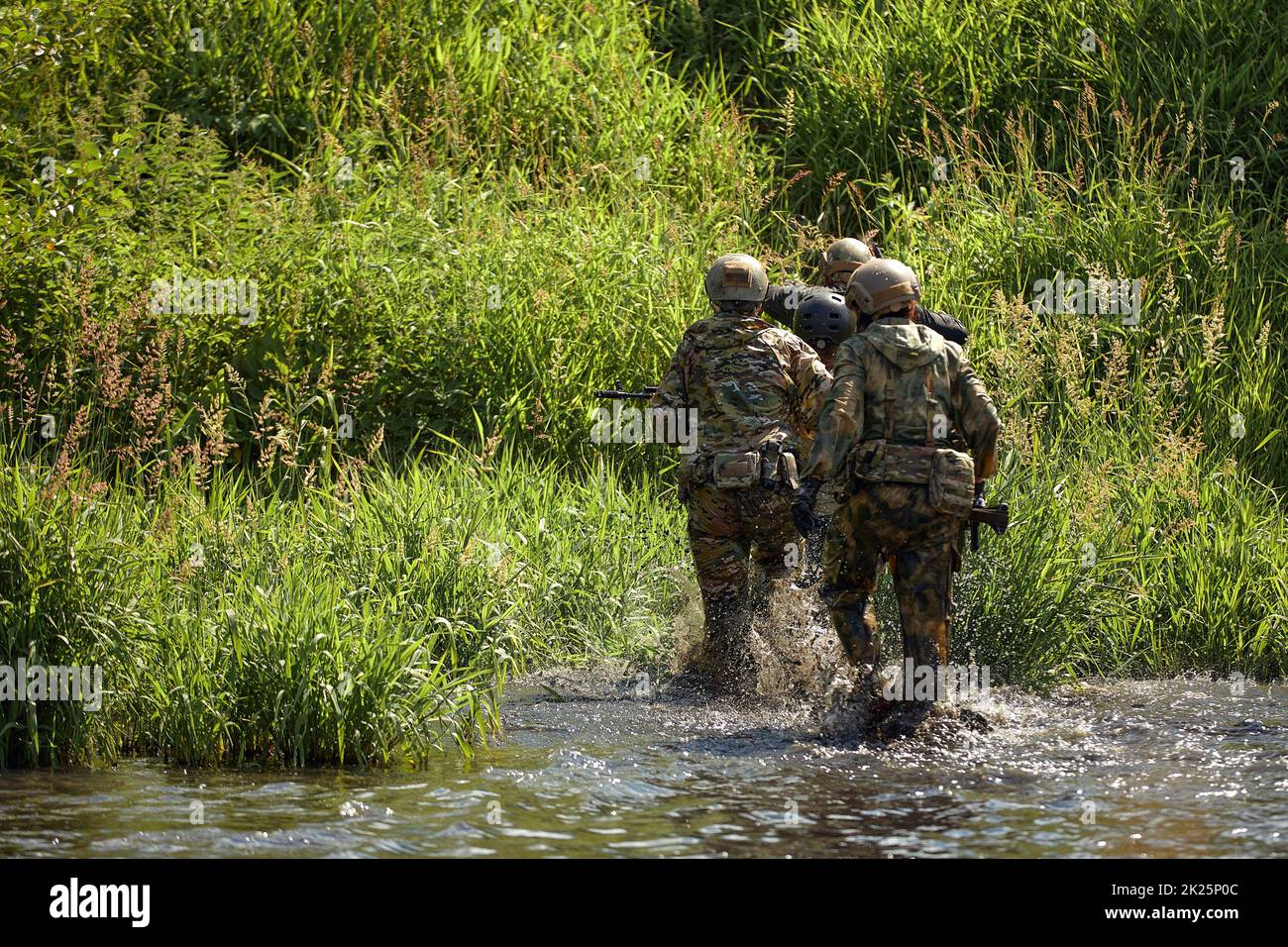 Special forces soldier with weapon take part in military maneuver. War ...
