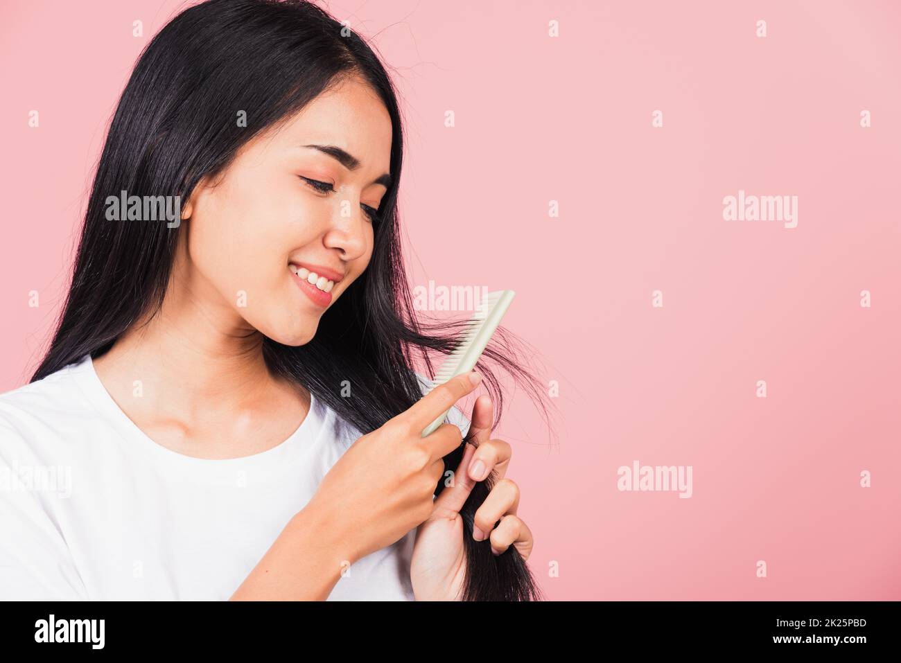 Beautiful woman combing hair hi-res stock photography and images - Alamy