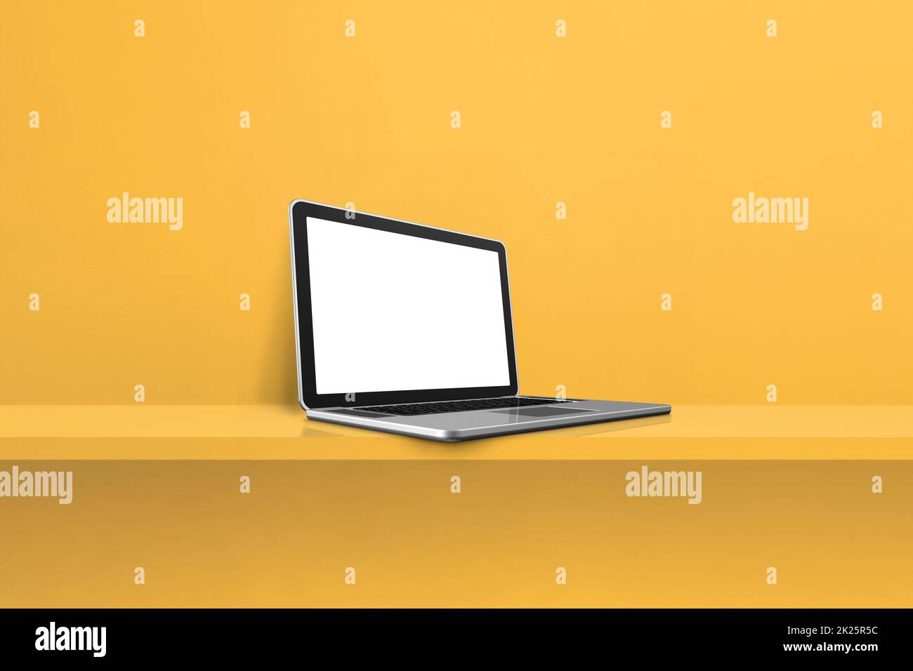 Laptop computer on yellow shelf background Stock Photo - Alamy