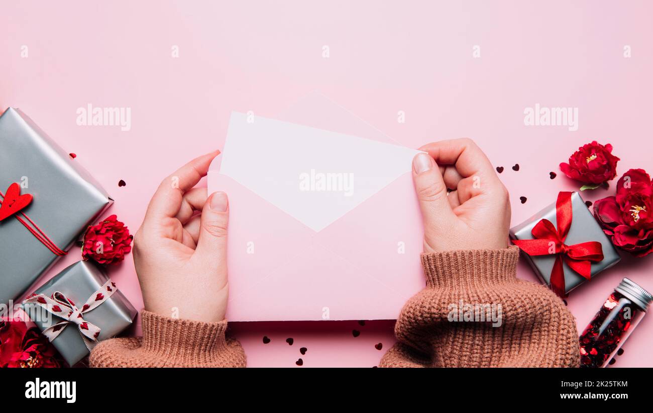 Female hands hold love letter message in envelope, Valentine's Day ...