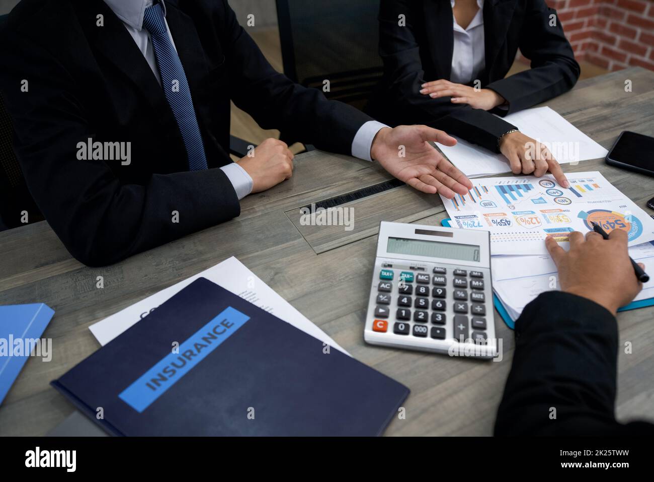 Business meeting on the desk at work. Human hands on a table with ...