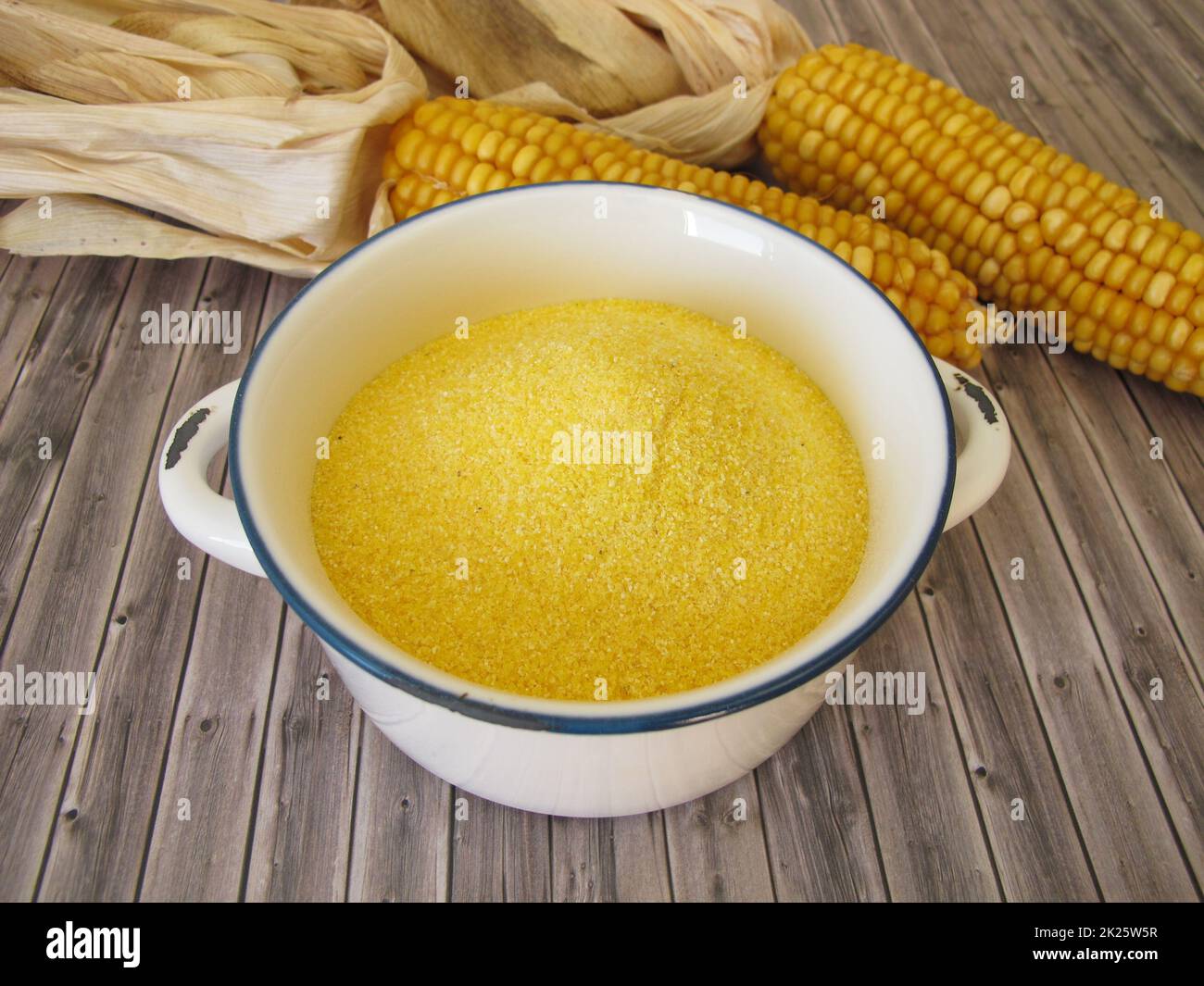 Corn semolina in a pot and maize ears Stock Photo - Alamy