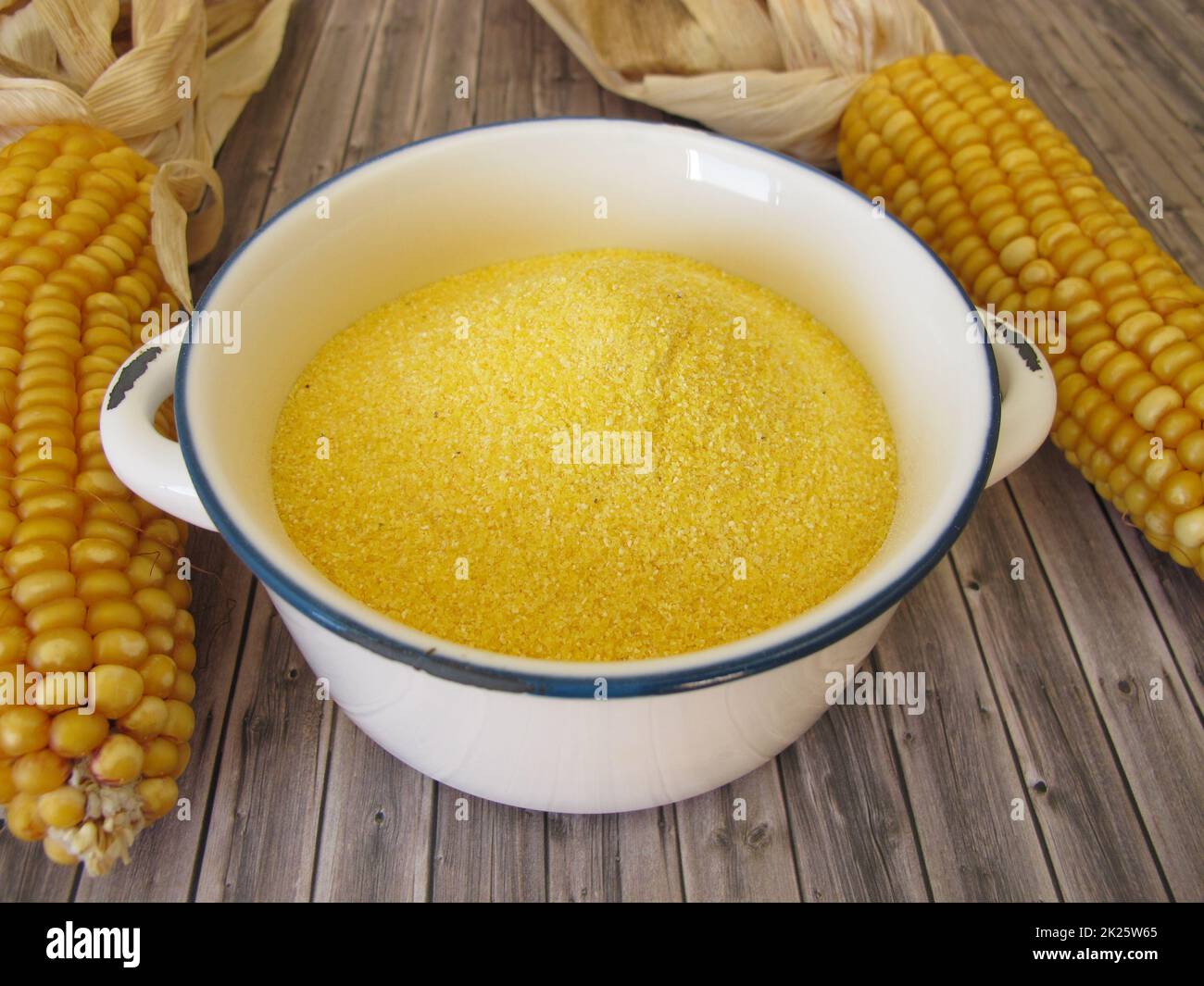 Corn semolina in a pot and maize ears Stock Photo - Alamy