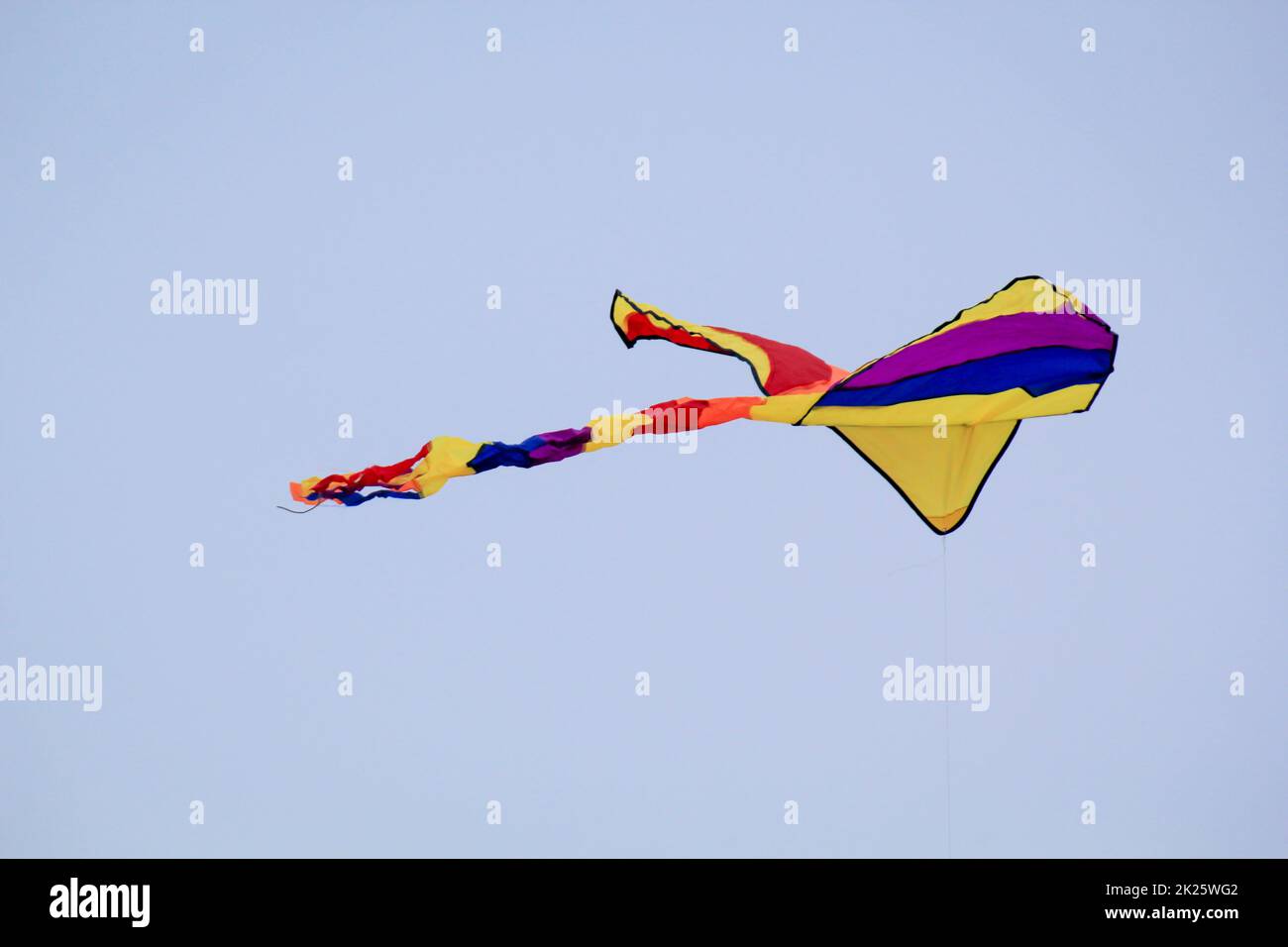A colorful stunt kite, kite with colorful tail in the sky Stock Photo ...