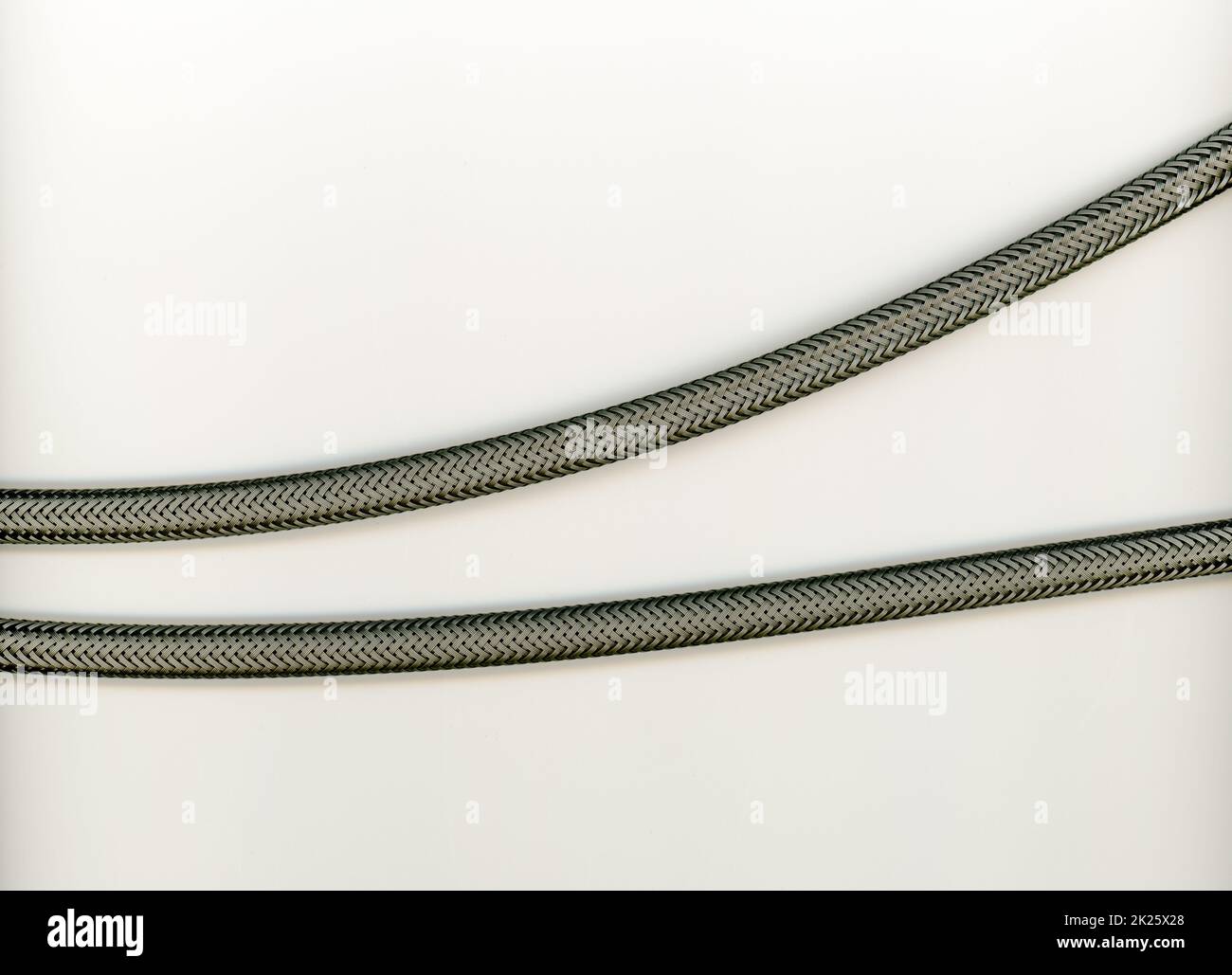 Stainless steel hybrid braided water inlet hose Stock Photo - Alamy