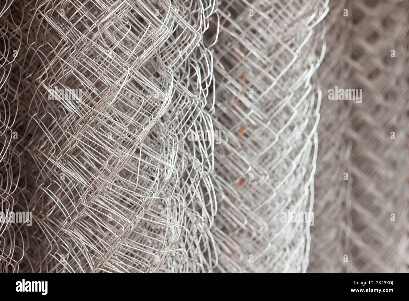 Metal mesh netting rolled into rolls. Rolled chain-link fence Stock ...