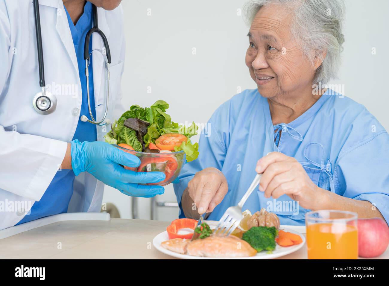 Asian senior or elderly old lady woman patient eating breakfast ...