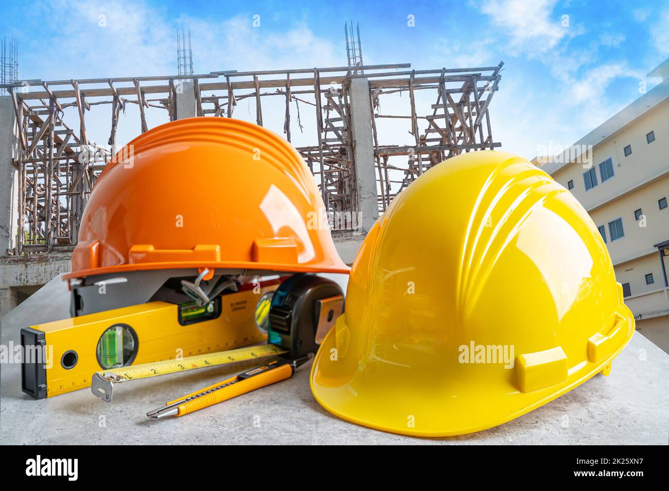 Safety first hard helmet hat and engineer tool at construction estate ...