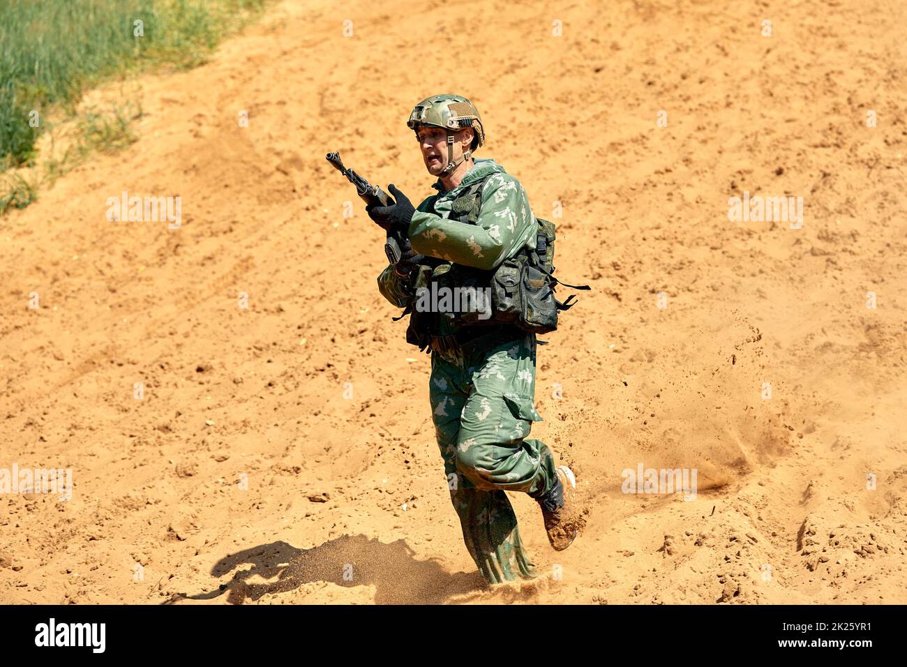 The soldier in the performance of tasks in camouflage and protective ...