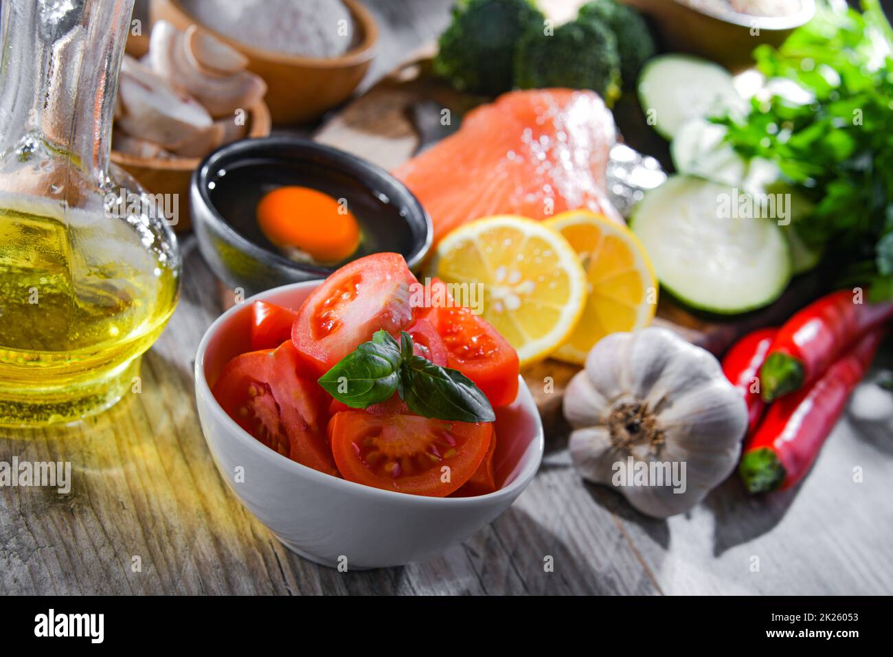 Fresh food ingredients prepared for cooking on a kitchen table Stock ...