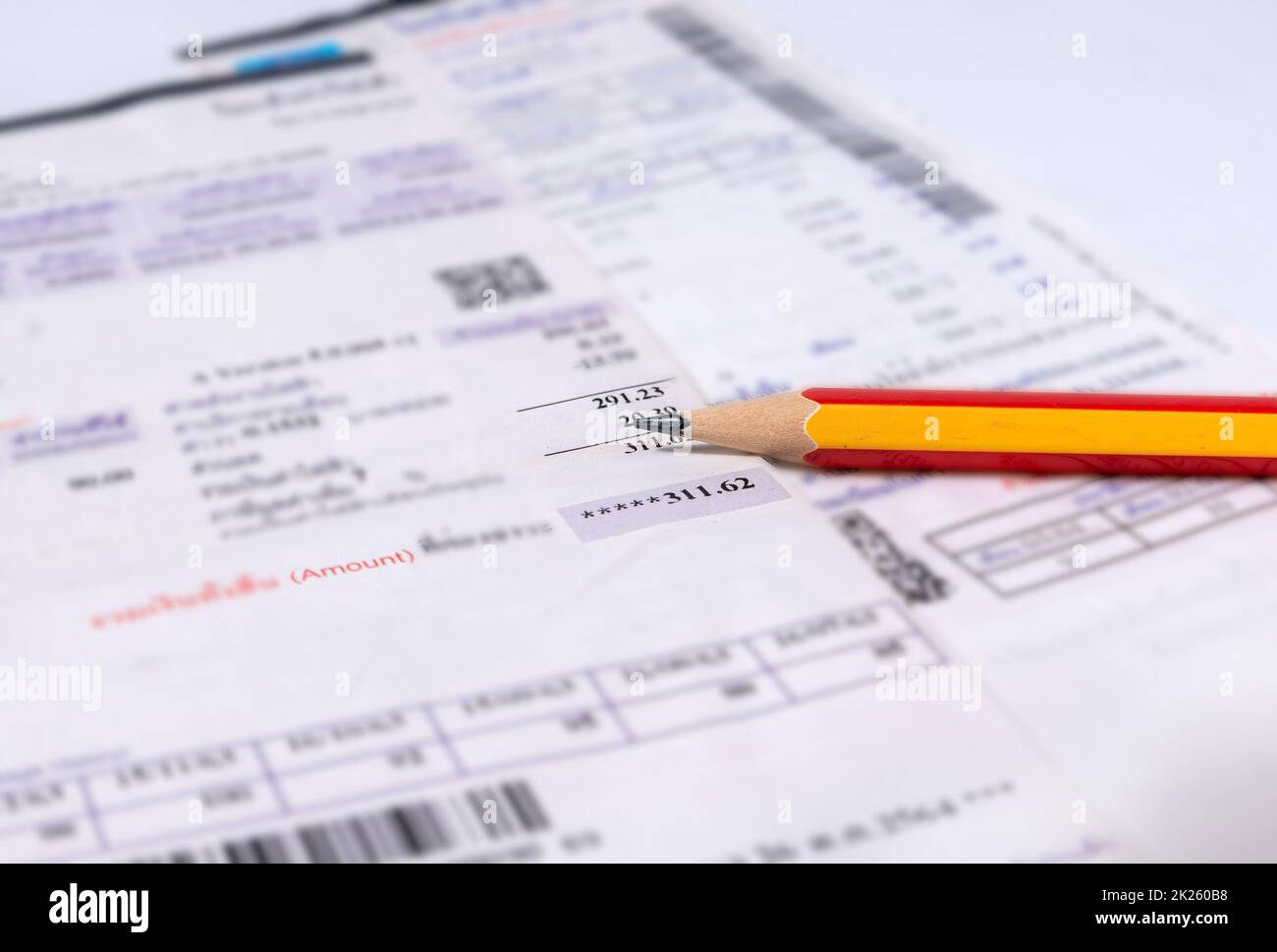 Utility energy bill with pencil blurred background Stock Photo - Alamy