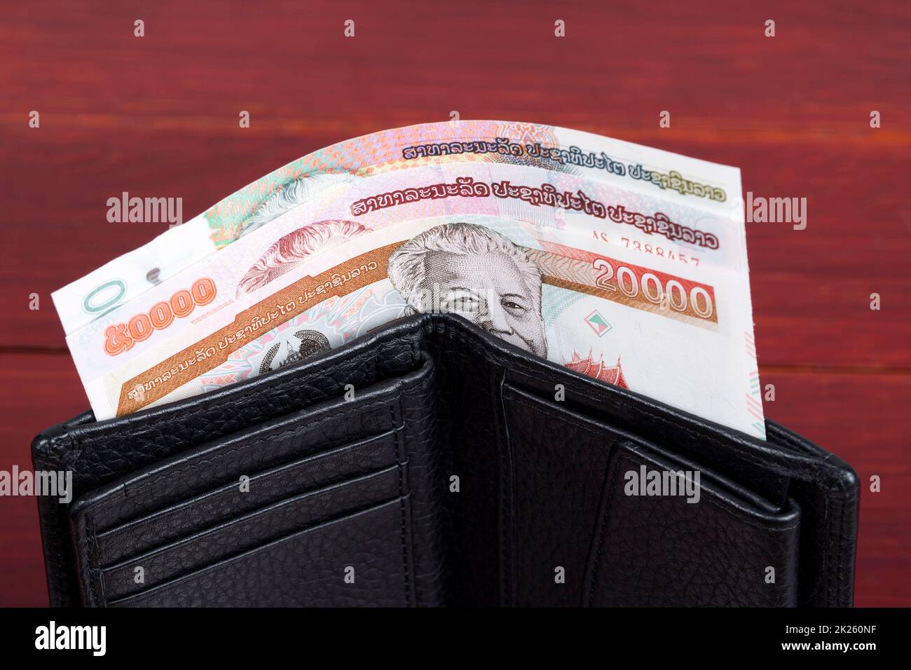 Lao money in the black wallet Stock Photo - Alamy
