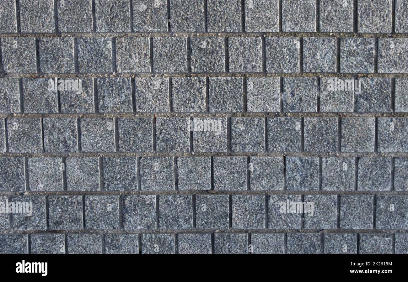Part of a road made up of square stone tiles Stock Photo - Alamy