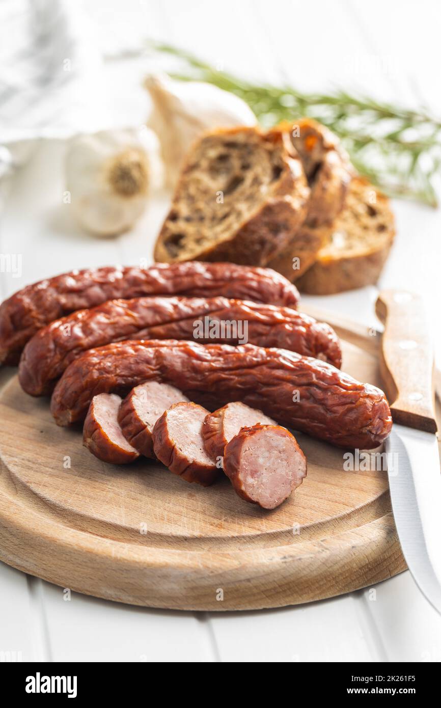 Smoked pork sausages. Sliced salami Stock Photo - Alamy