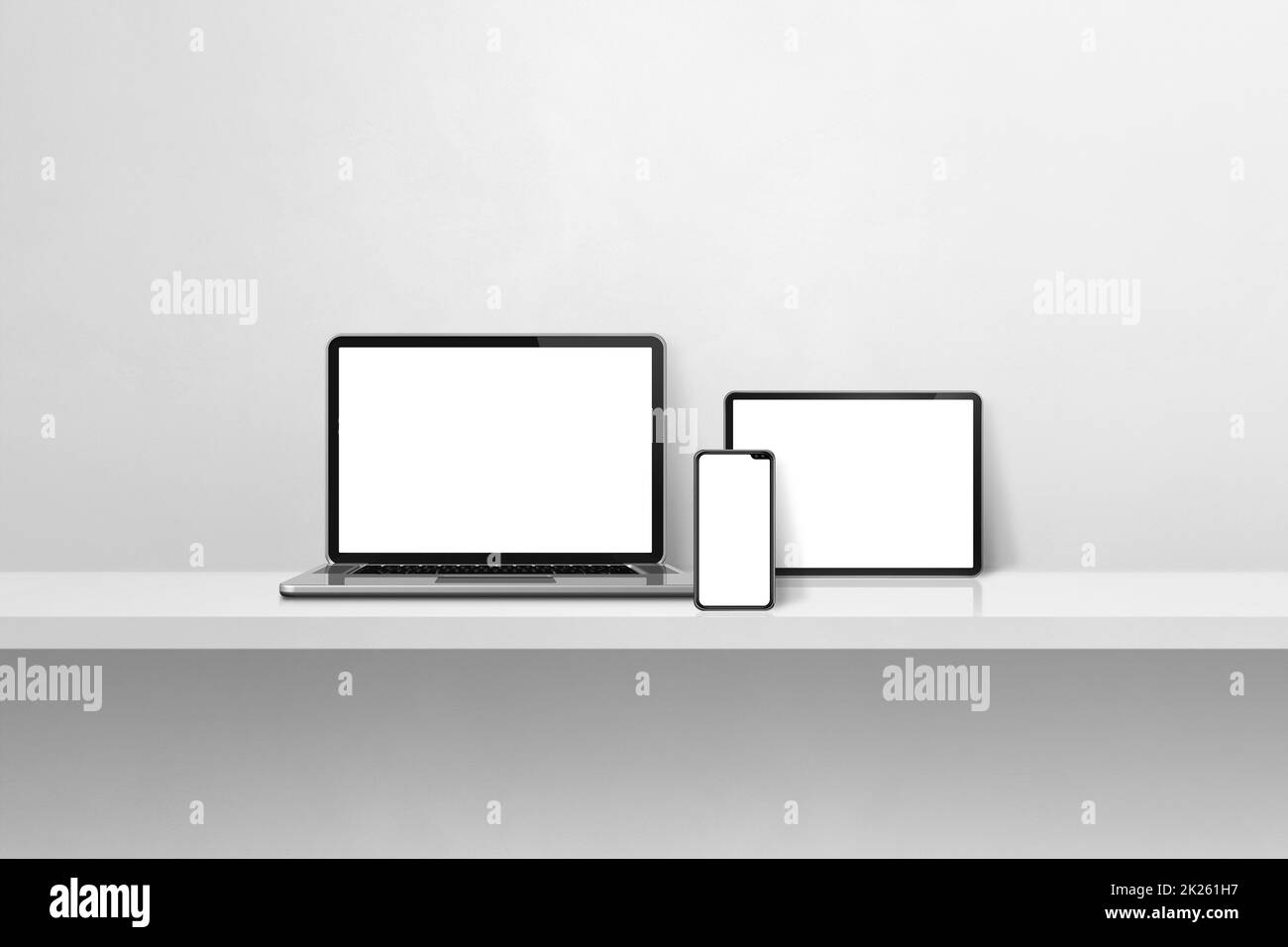 Laptop, mobile phone and digital tablet pc on white concrete wall shelf ...