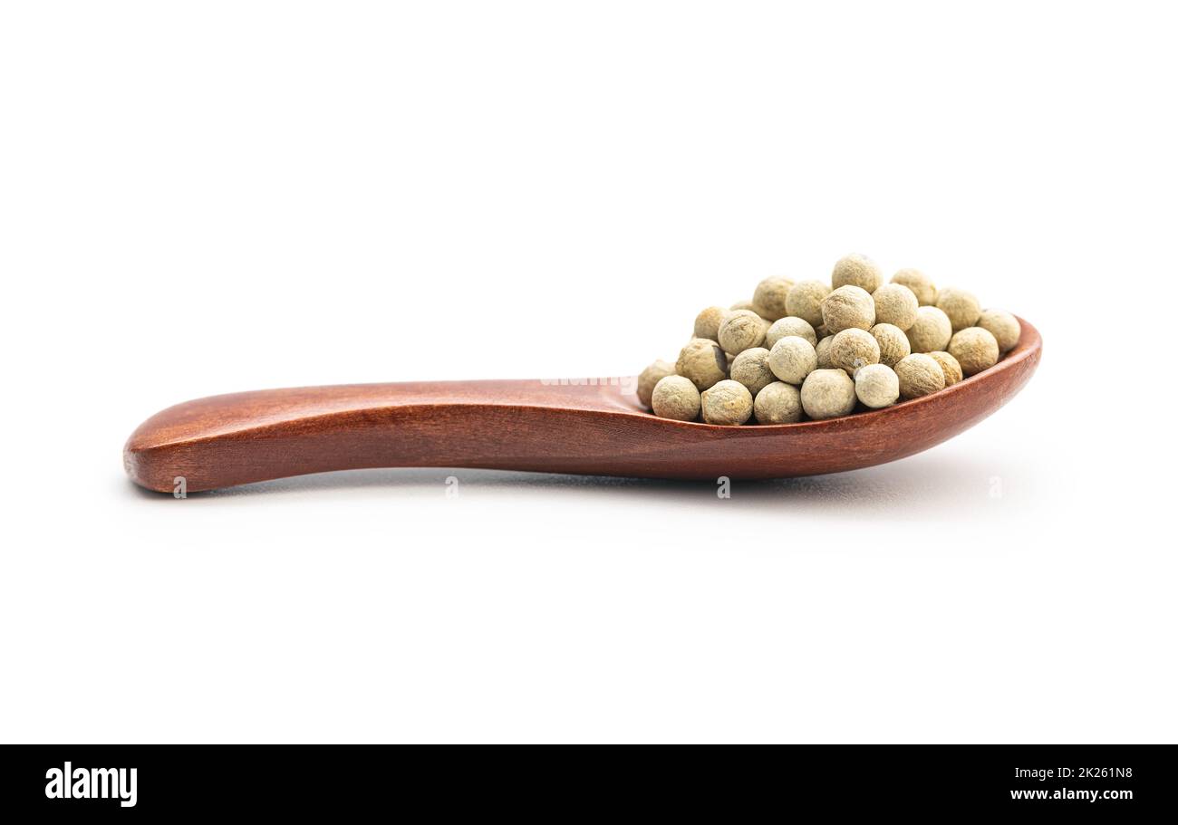 Whole pepper spice. White peppercorn grain in wooden spoon Stock Photo ...