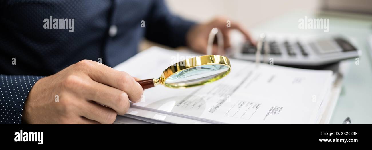 Auditor Using Magnifying Glass For Audit Stock Photo - Alamy
