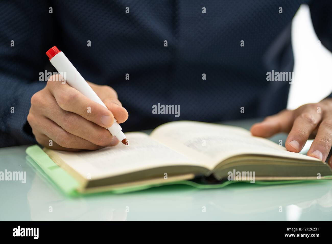 Man Hand With Highlighter Reading Book Stock Photo - Alamy
