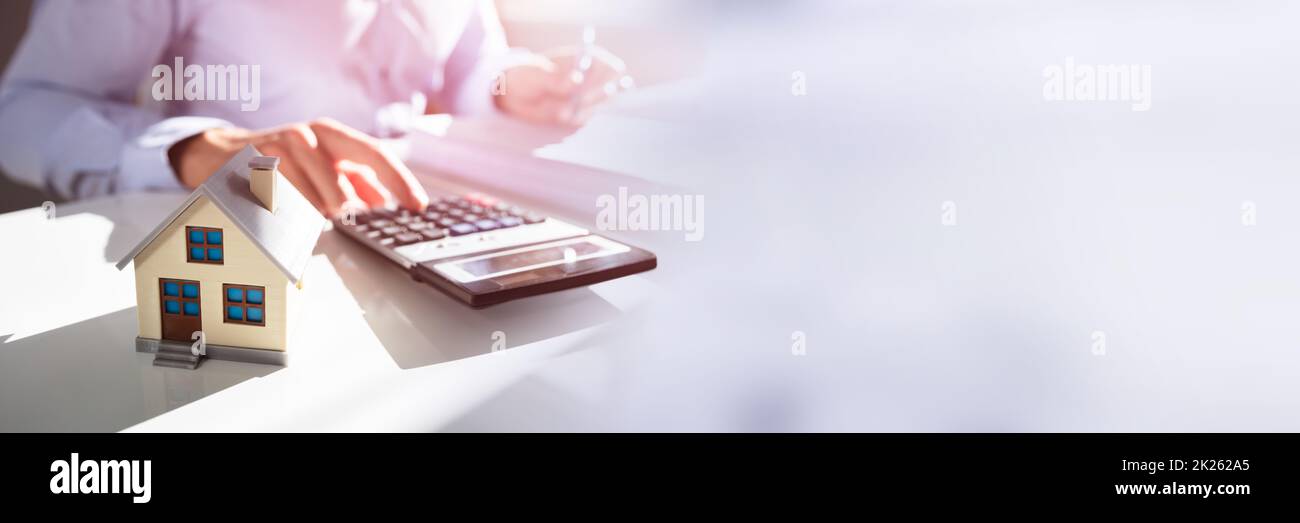 Businessperson Calculating Property Tax Stock Photo - Alamy