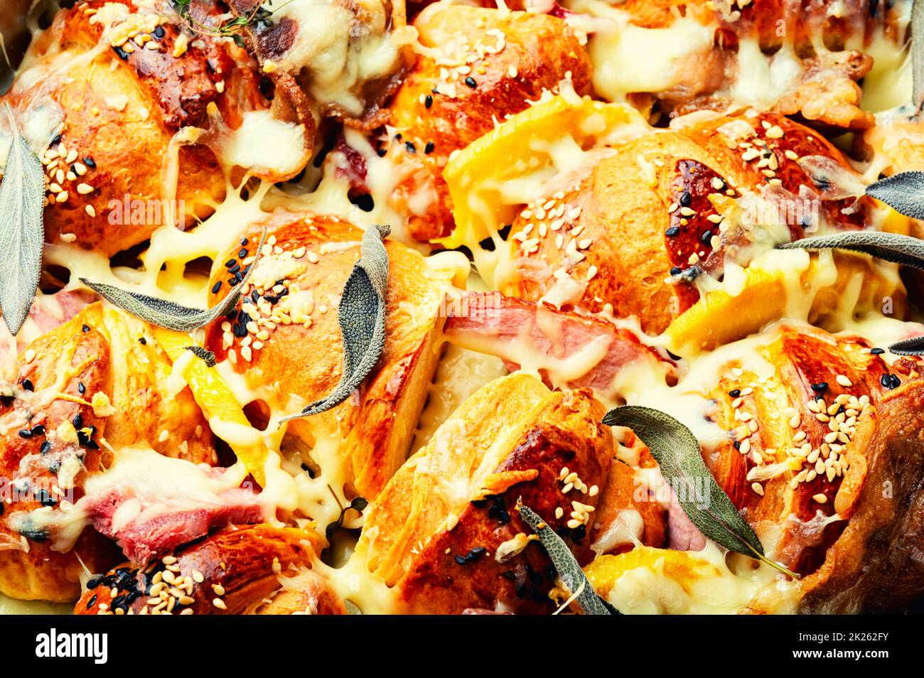 Croissants baked with cheese and meat Stock Photo - Alamy