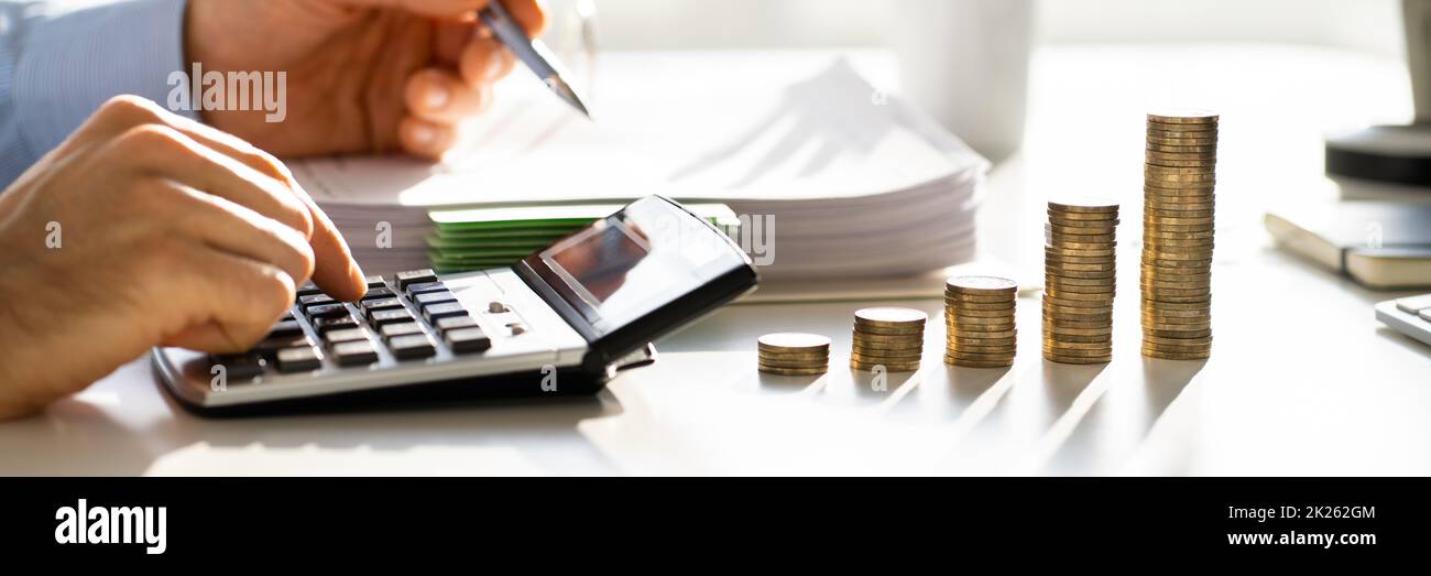 Accountant Calculating Tax Using Calculator On Desk Stock Photo - Alamy Accountant Calculating Tax Using Calculator On Desk Stock Photo - Alamy