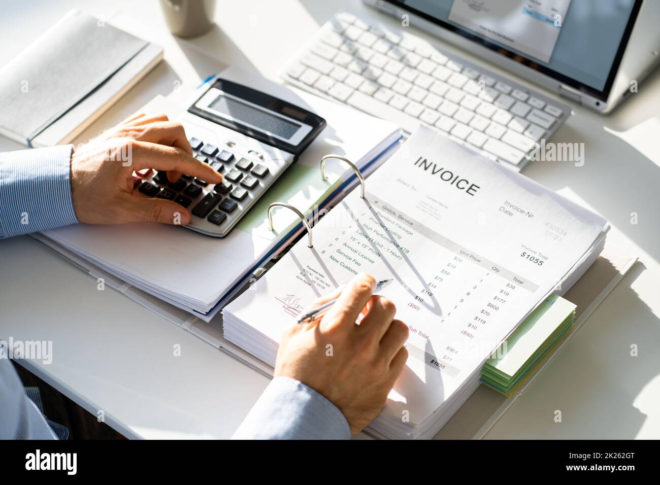 Young accountant using calculator hi-res stock photography and images ...