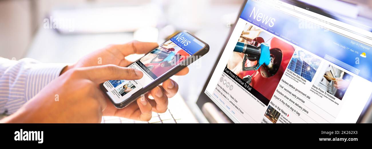 Reading News Website Online Stock Photo - Alamy