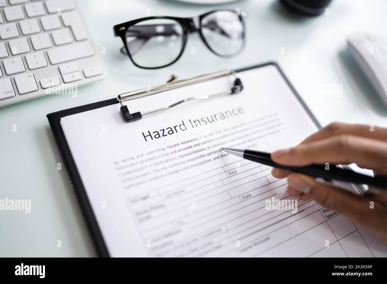 Man Filling Hazard Insurance Form Stock Photo - Alamy