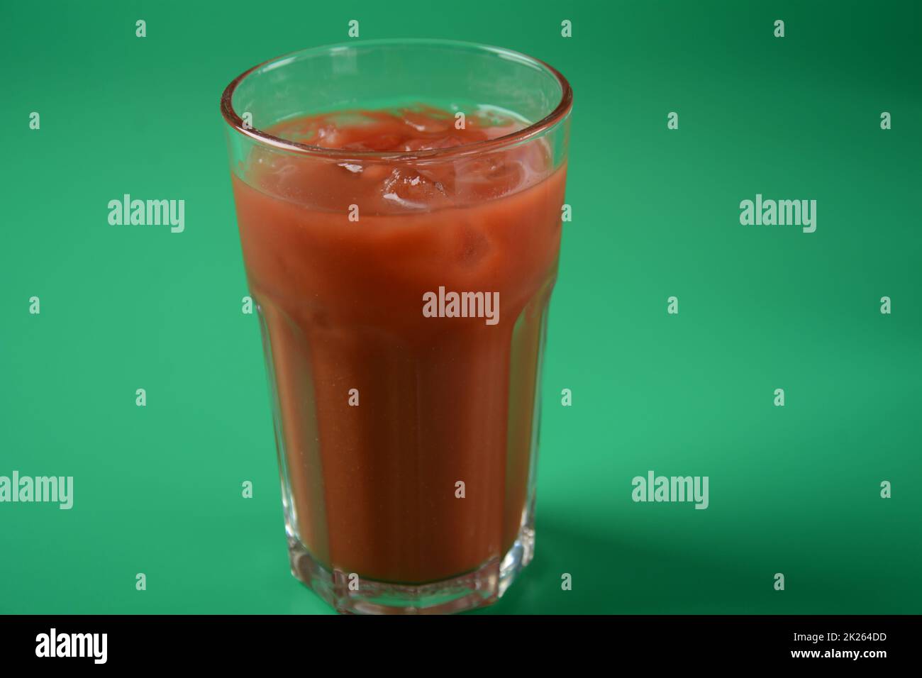 Full glass of fresh tomato juice with cherry tomatoes around . Very ...