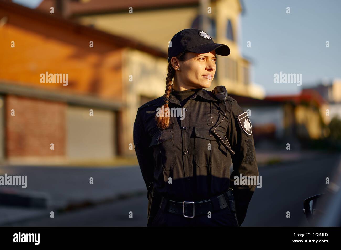 Woman police officer in uniform outdoors portrait Stock Photo - Alamy