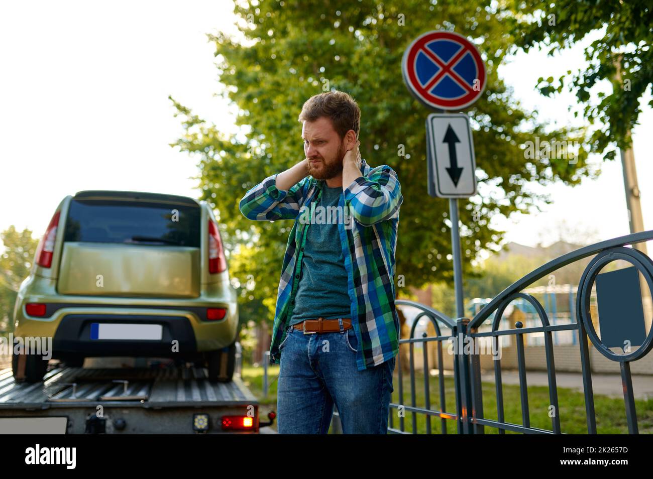 Sad man and evacuation wrong parked car Stock Photo - Alamy