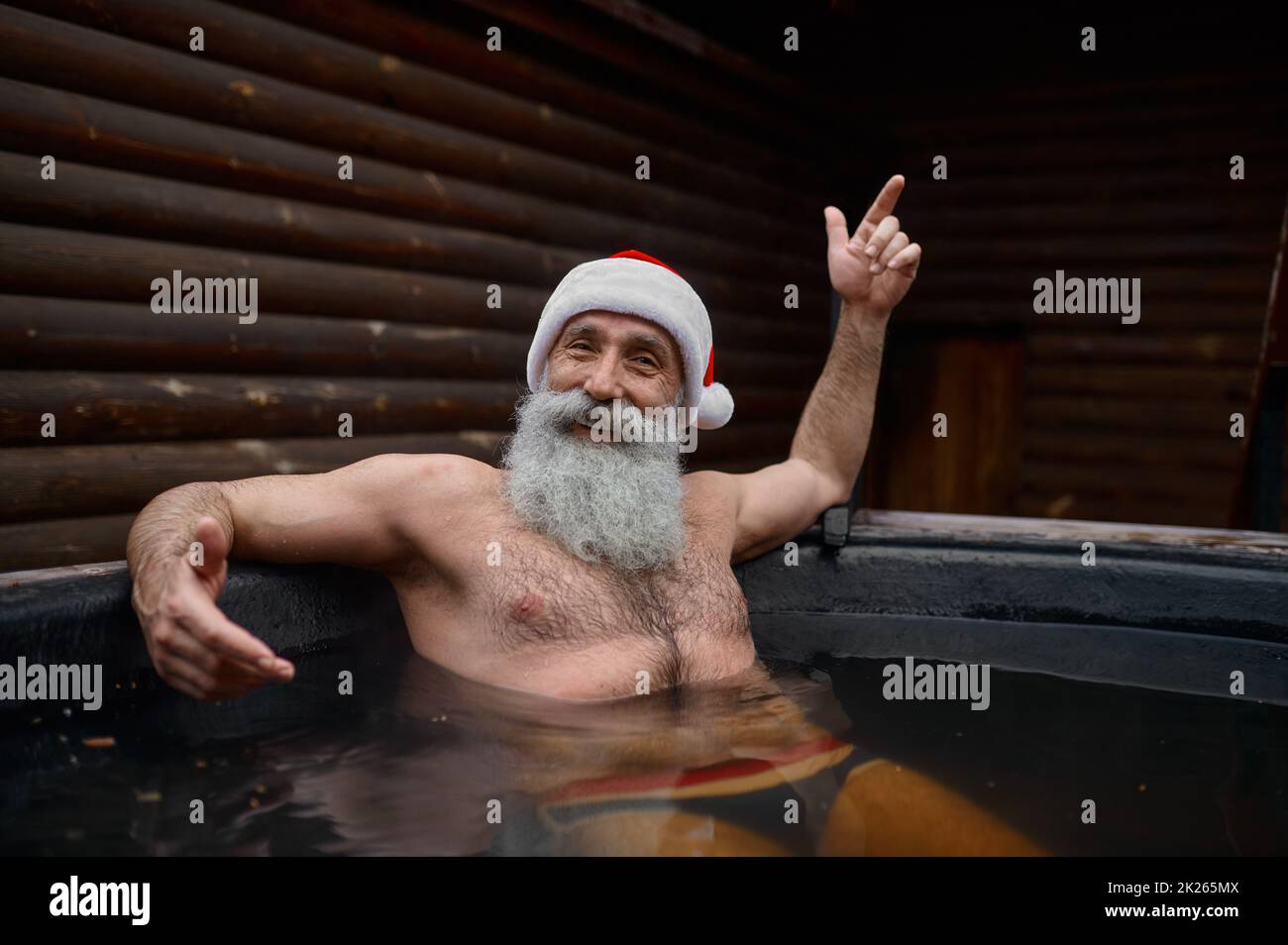 Santa Claus resting in bath vat outside Stock Photo - Alamy