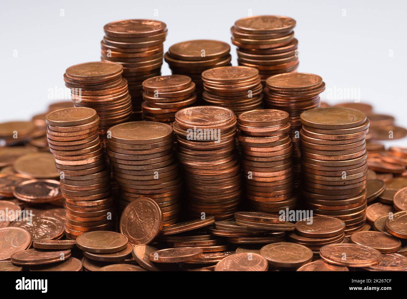 Copper coins stacked in columns Stock Photo - Alamy