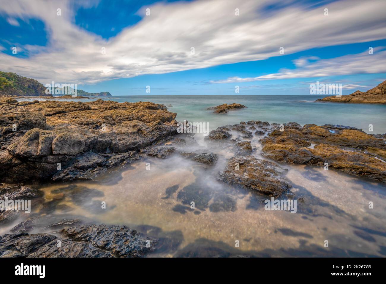 Long exposure, pacific ocean waves on rock in Playa Ocotal, El Coco ...