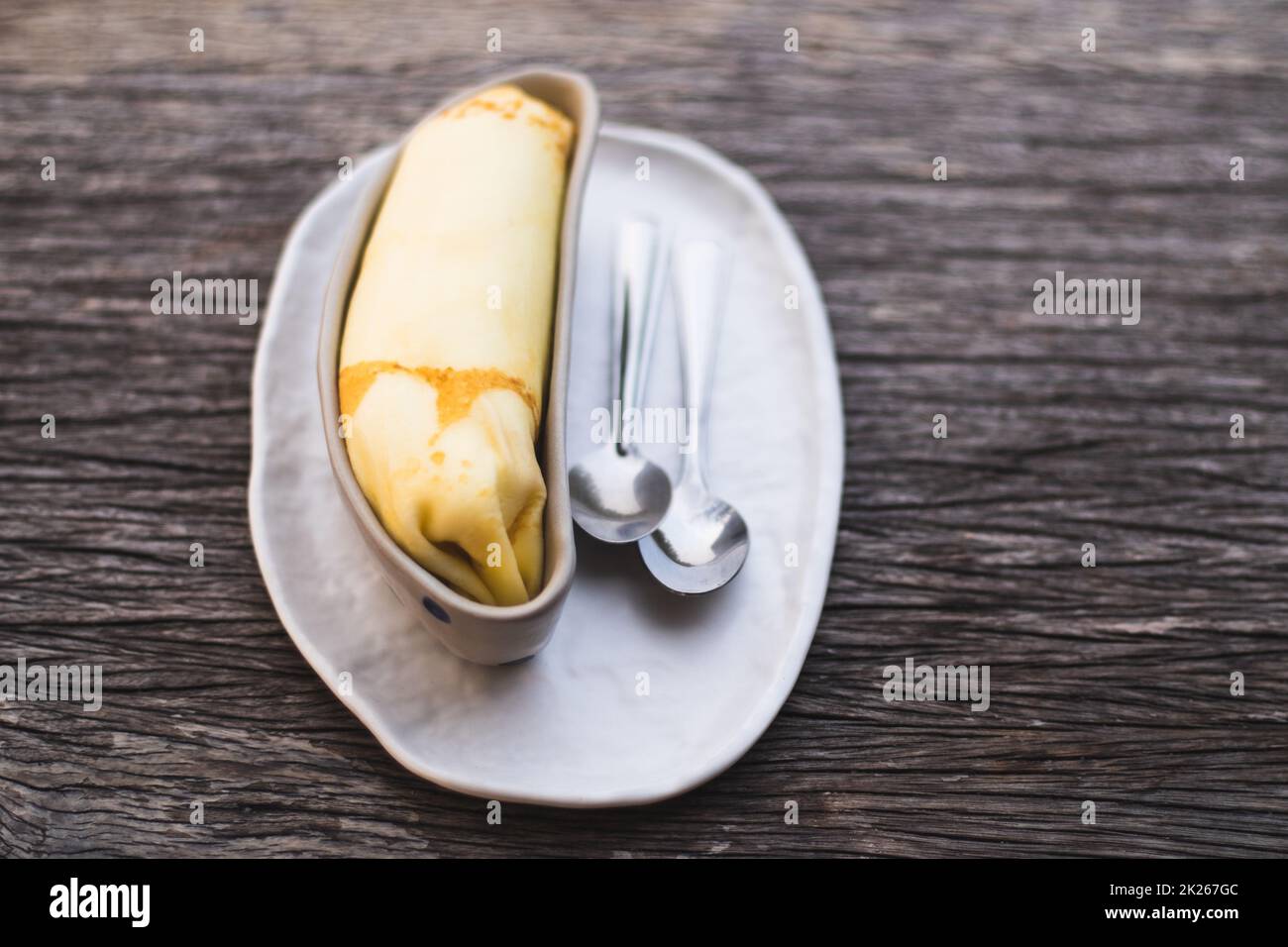 Banana crepe sweet dessert object still life. The crepe put in the ...