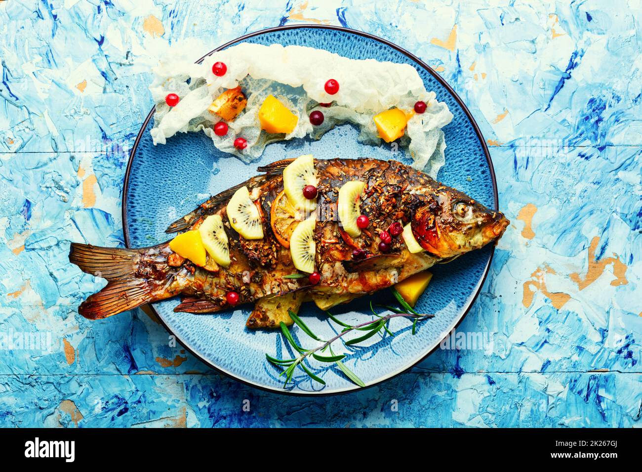 Prepared fish carp with fruits Stock Photo - Alamy