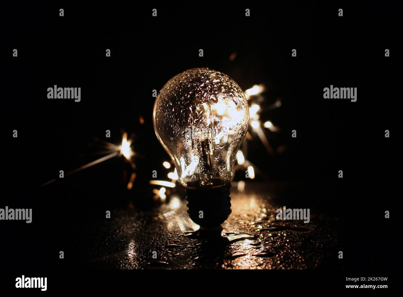 Light bulb with sparks Stock Photo - Alamy