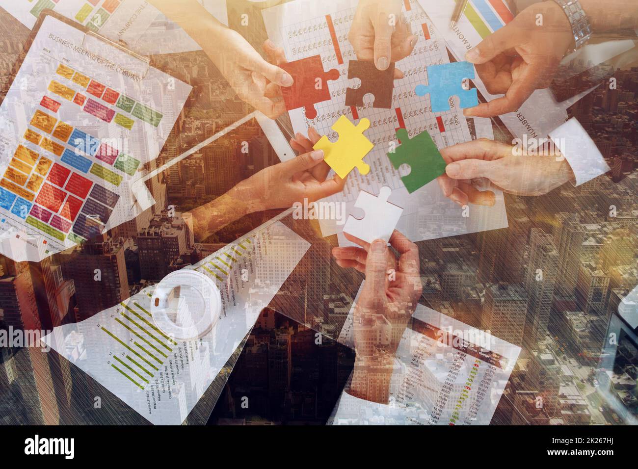 Teamwork of partners connect puzzle pieces as integration and startup ...