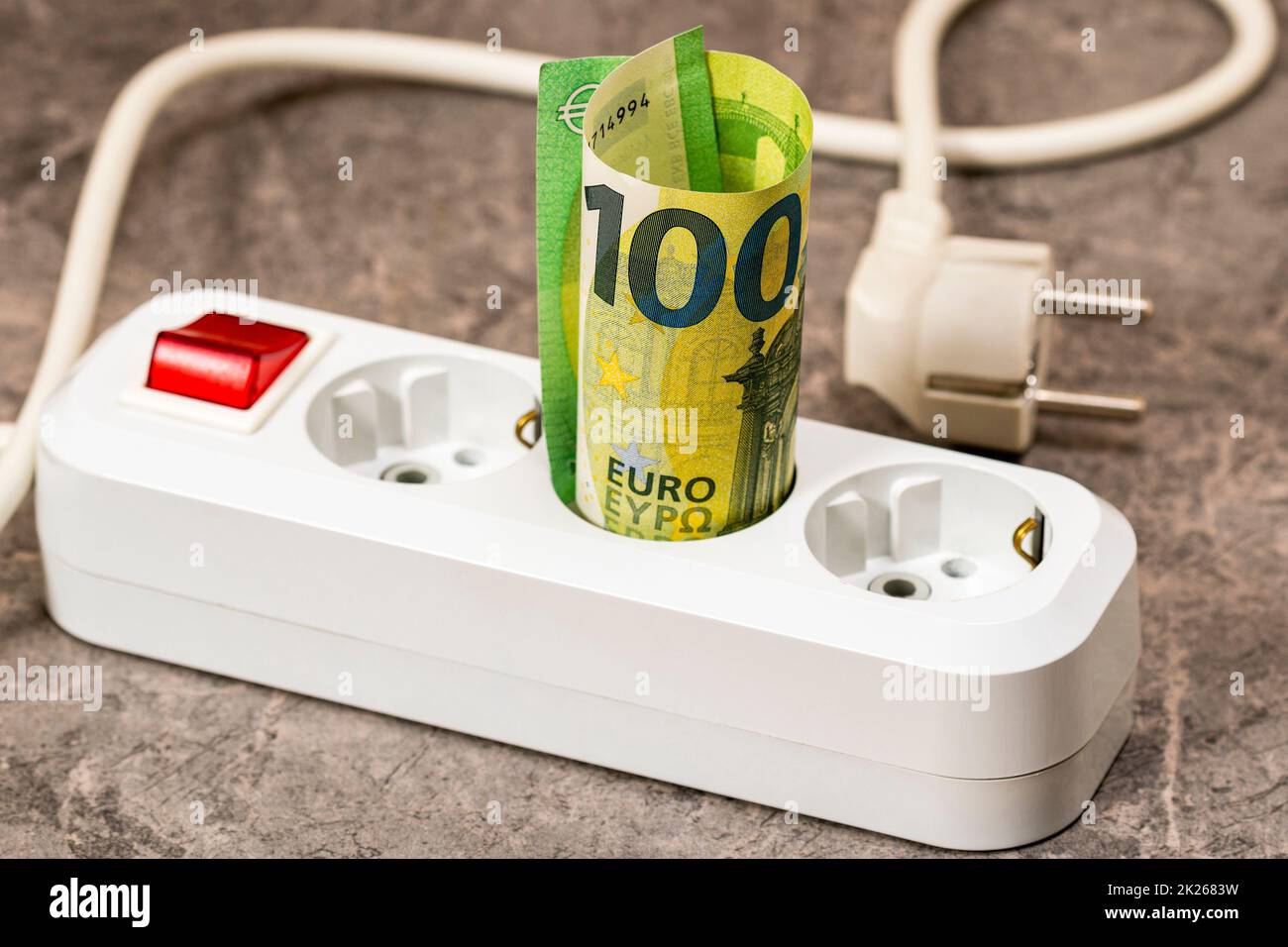Euro money paper banknote inserted into an extension socket Stock Photo ...