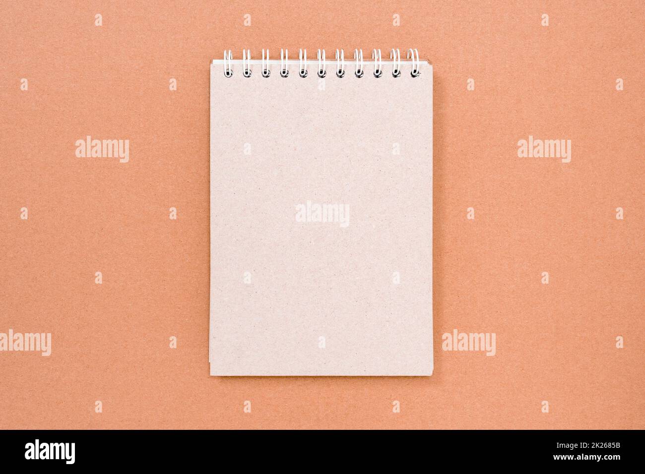 Blank spiral bound notepad on the cardboard background Stock Photo - Alamy