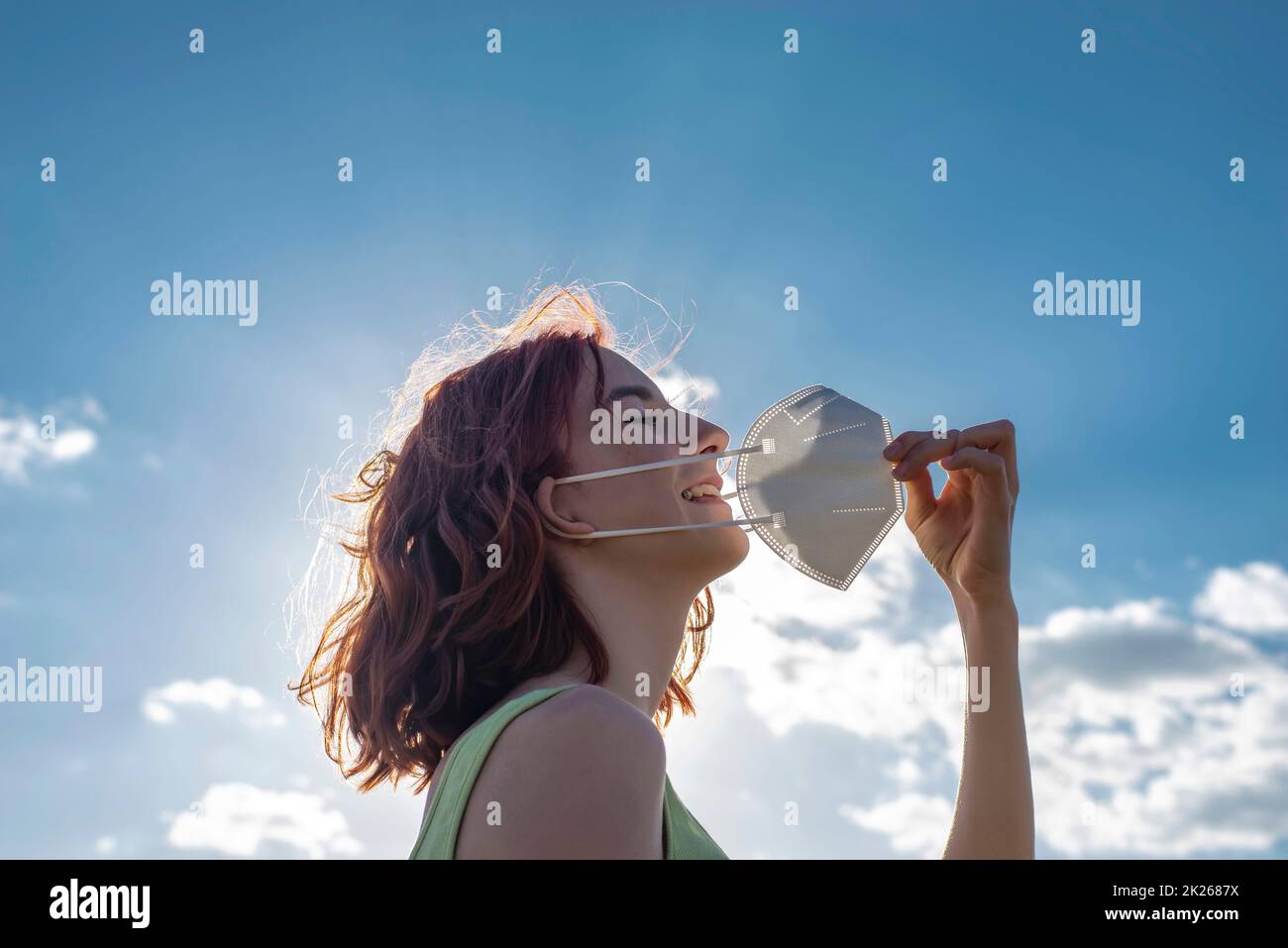 girl taking off protection mask Stock Photo - Alamy