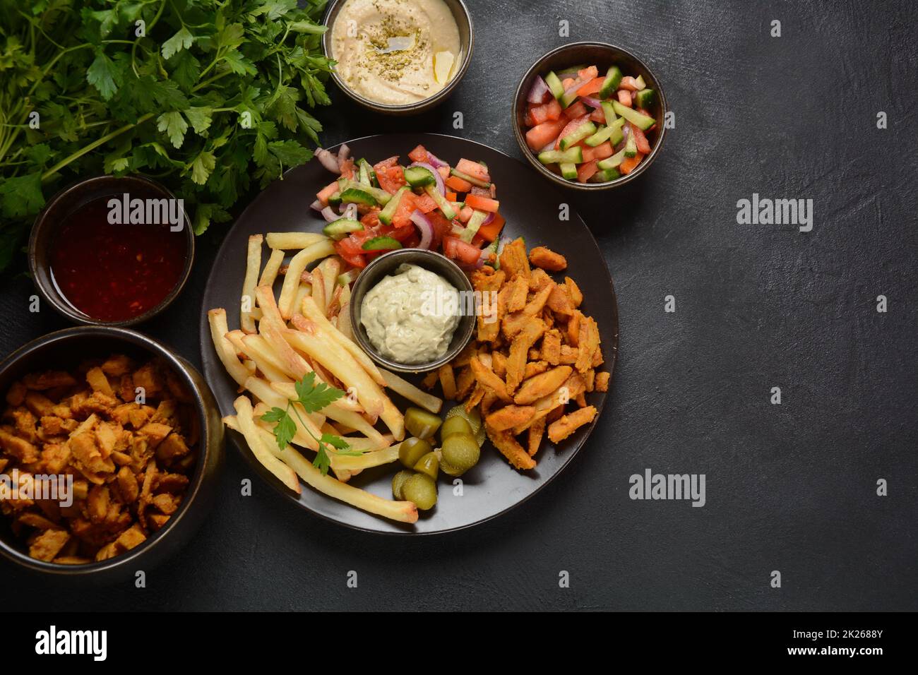 Shawarma with Sauce and vegetables, with chicken, fries and pickles ...