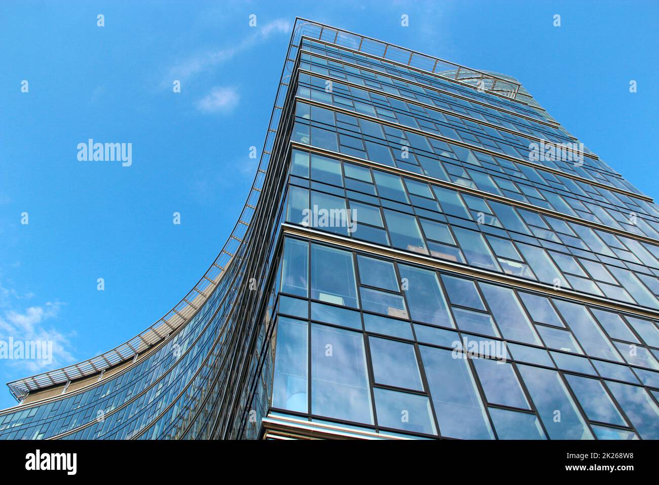 High glass skyscraper in Warsaw. Modern architecture of city buildings ...