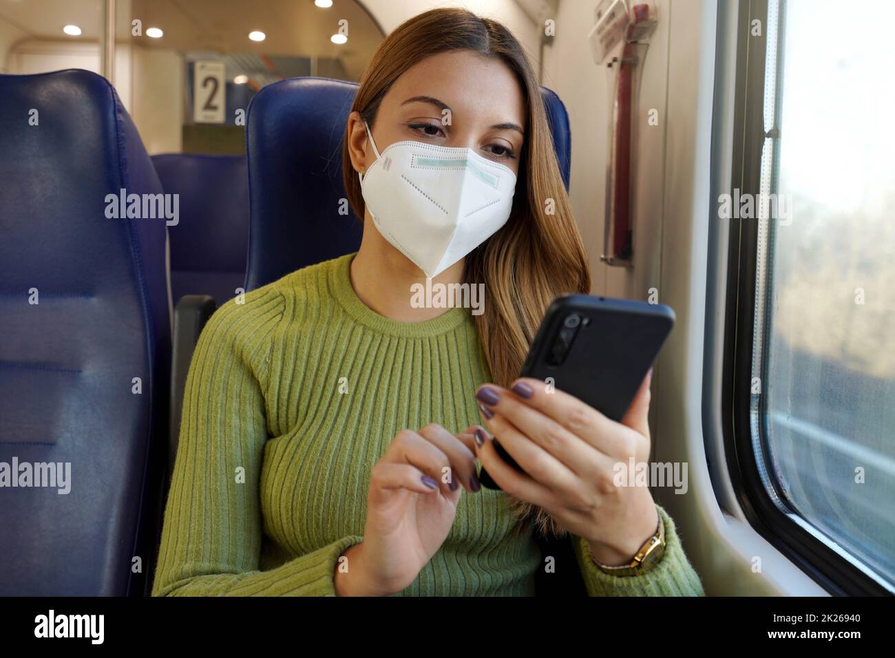 Woman traveling in train holding hi-res stock photography and images - Alamy
