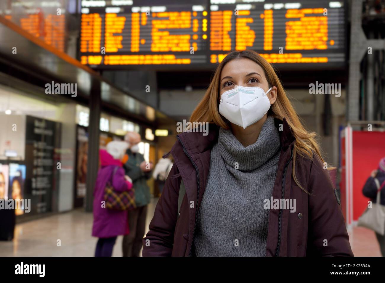 Traveler woman wearing medical face mask at the airport. Happy young ...
