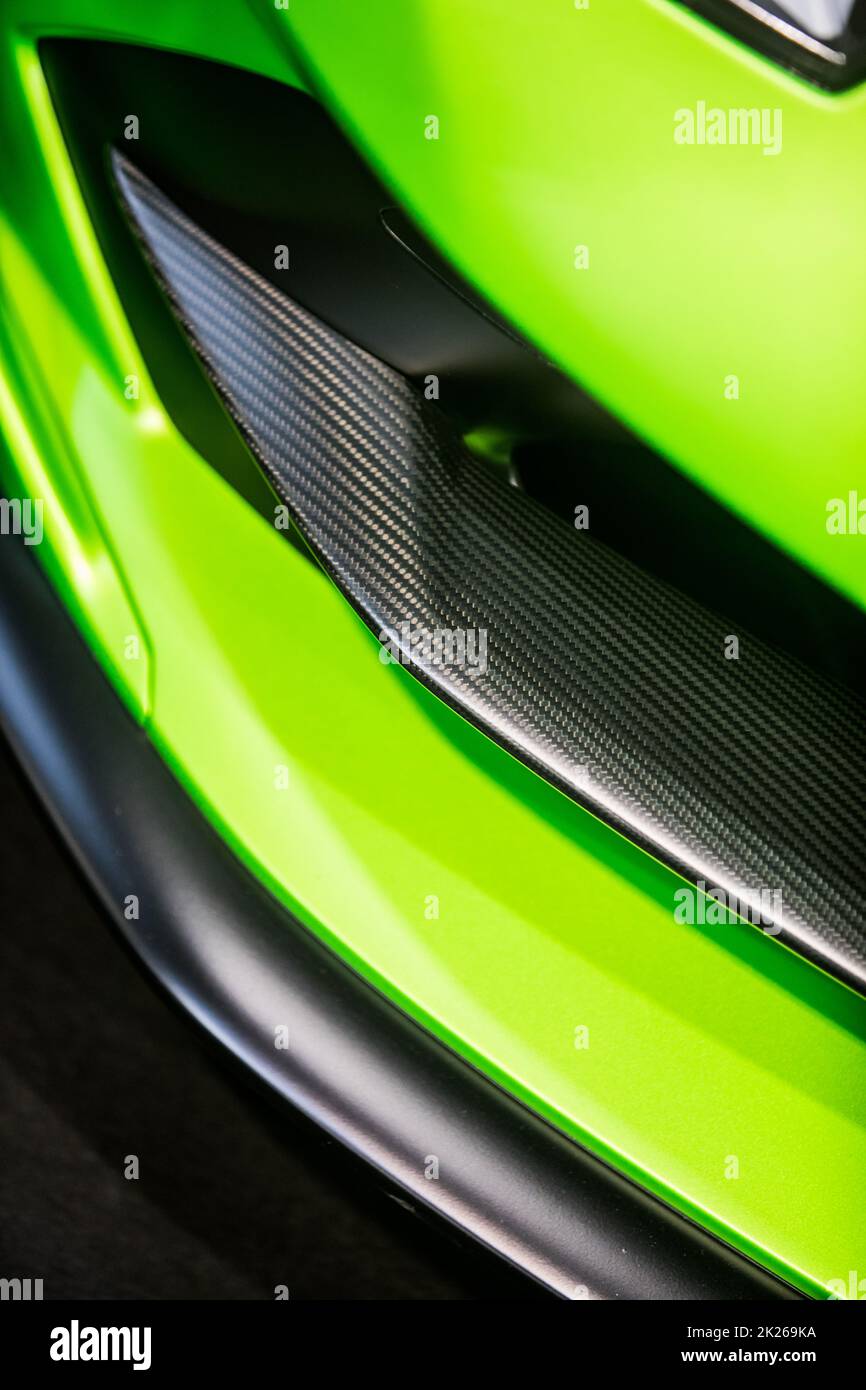 Exotic car's front bumper, with carbon fiber elements Stock Photo - Alamy
