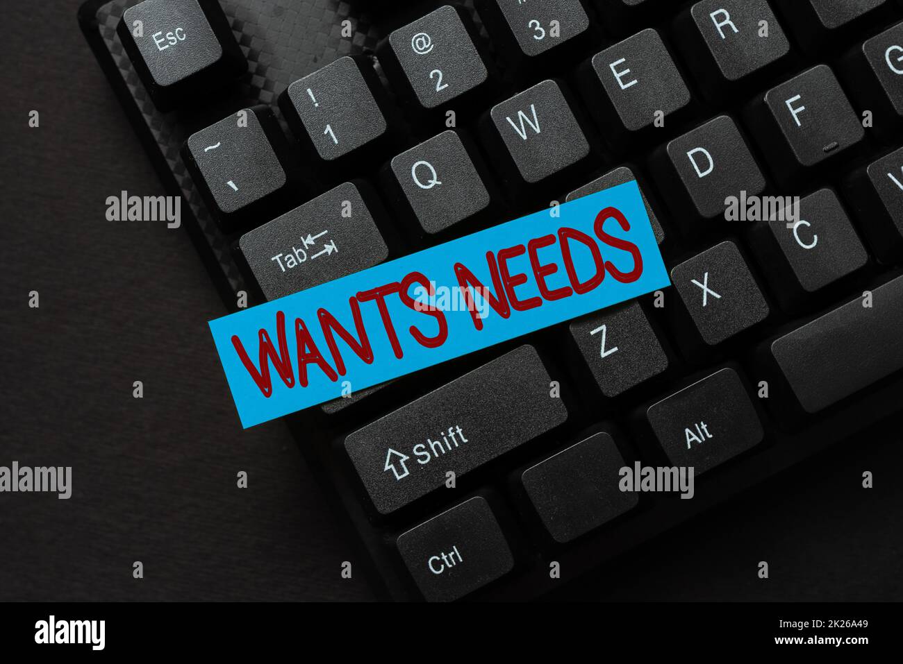 Hand writing sign Wants Needs. Word for to have something necessary or ...