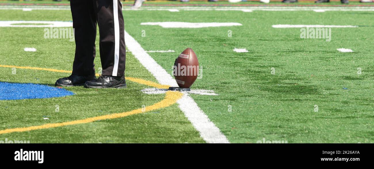 Football Field With Football On Tee